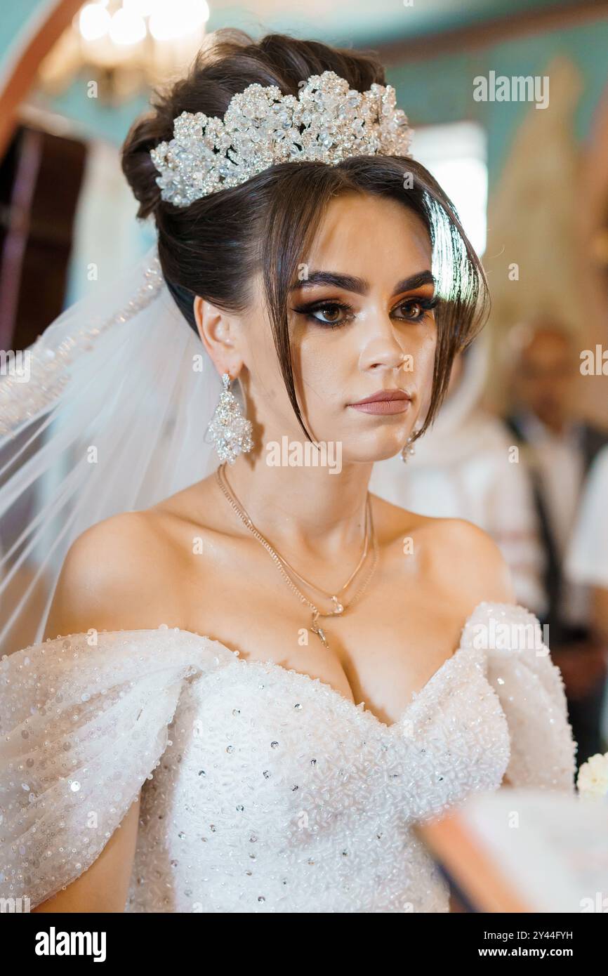 Elegant Bride in Sparkling White Gown with Ornate Tiara and Veil Stock ...
