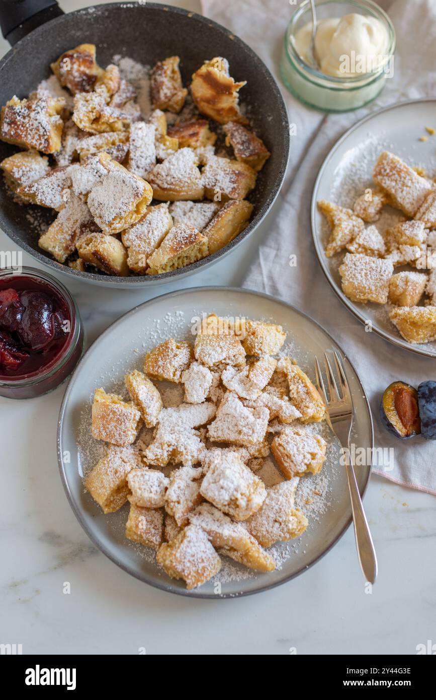 Kaiserschmarrn - traditional austrian pancake dessert with plums Stock ...