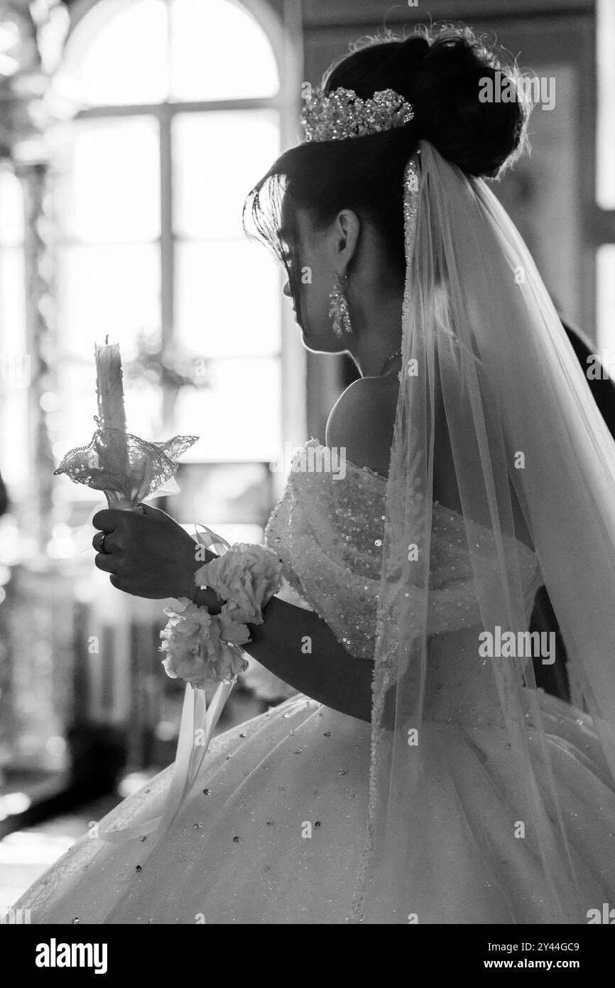 Elegant Black and White Portrait of Bride in Sparkling Gown Holding ...