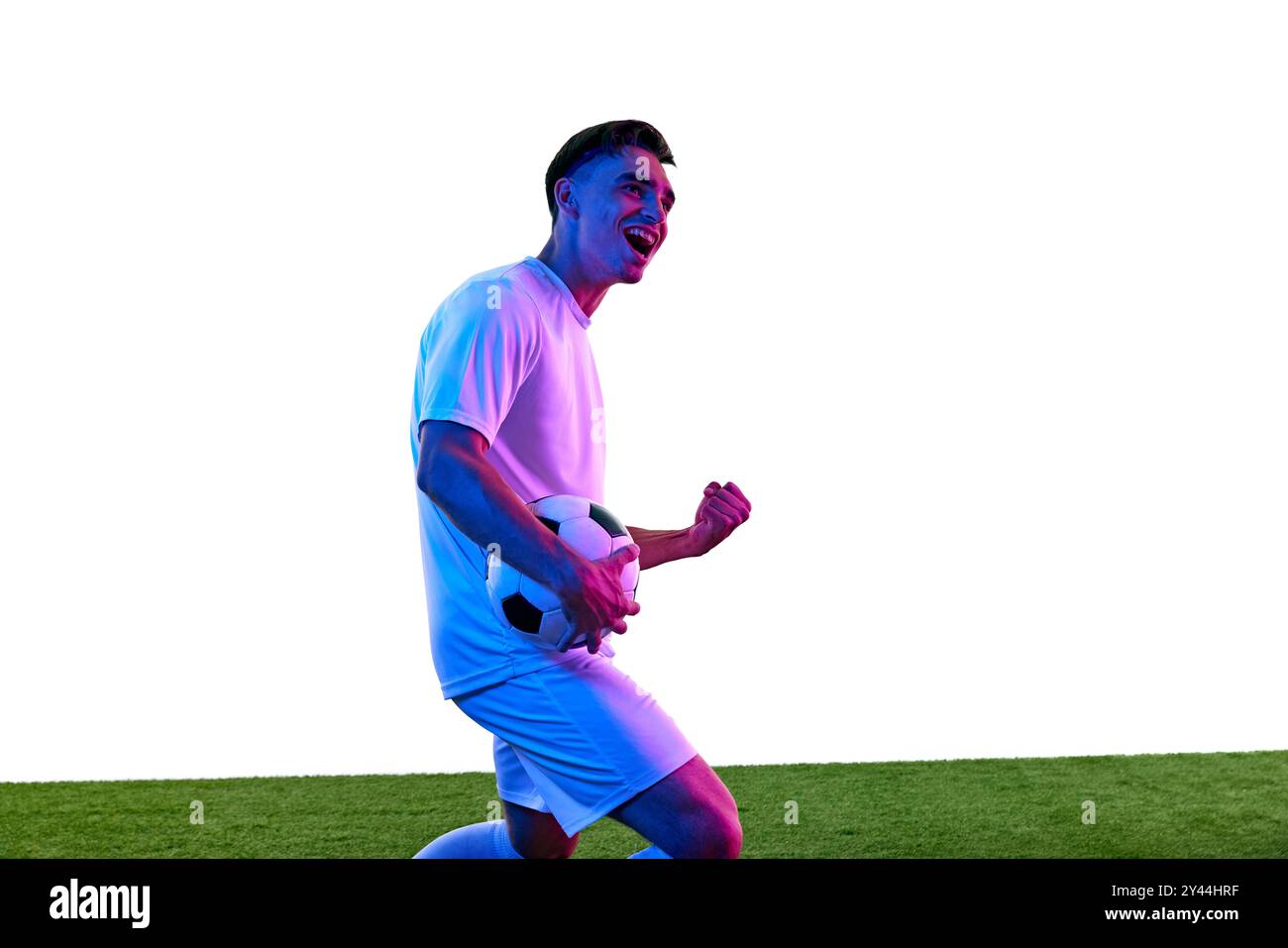 Football player wearing white uniform celebrates after successful goal ...