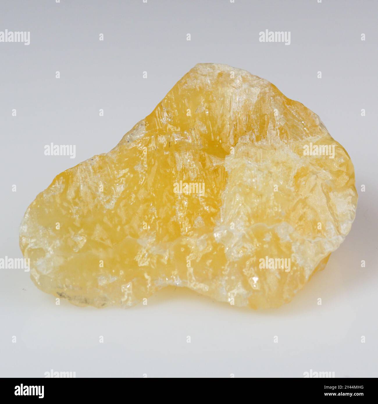 Vibrant Raw Yellow Calcite Crystal Gemstone on Soft Gray Background ...
