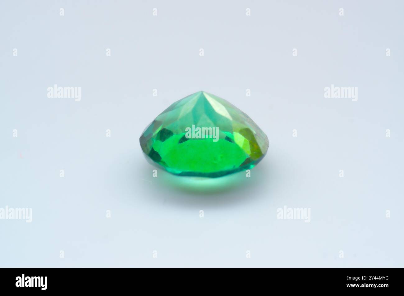 Elegant Emerald Gemstone on Minimalist White Background Showcasing ...