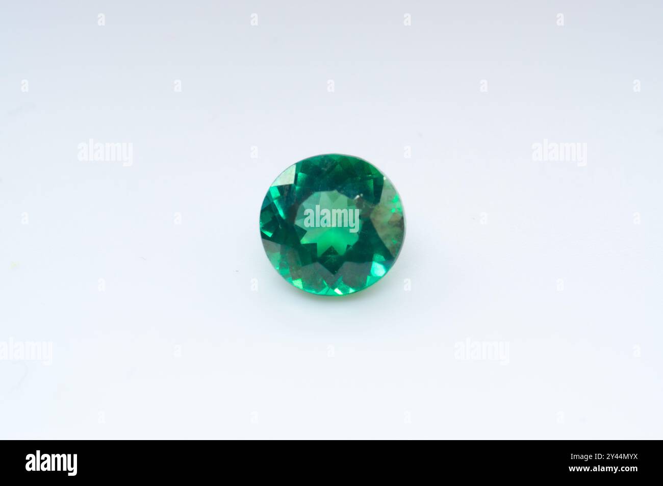 Captivating Emerald Gemstone on Soft White Background Displaying ...