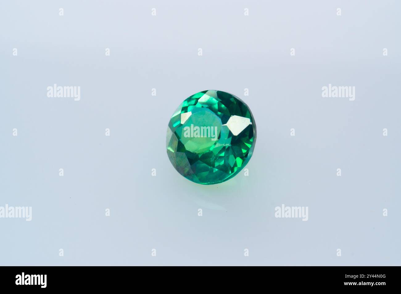 Exquisite Polished Emerald Gemstone on Smooth White Background Stock ...