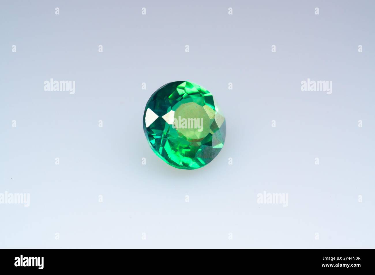Sparkling Emerald Gemstone on Pristine White Background Capturing ...