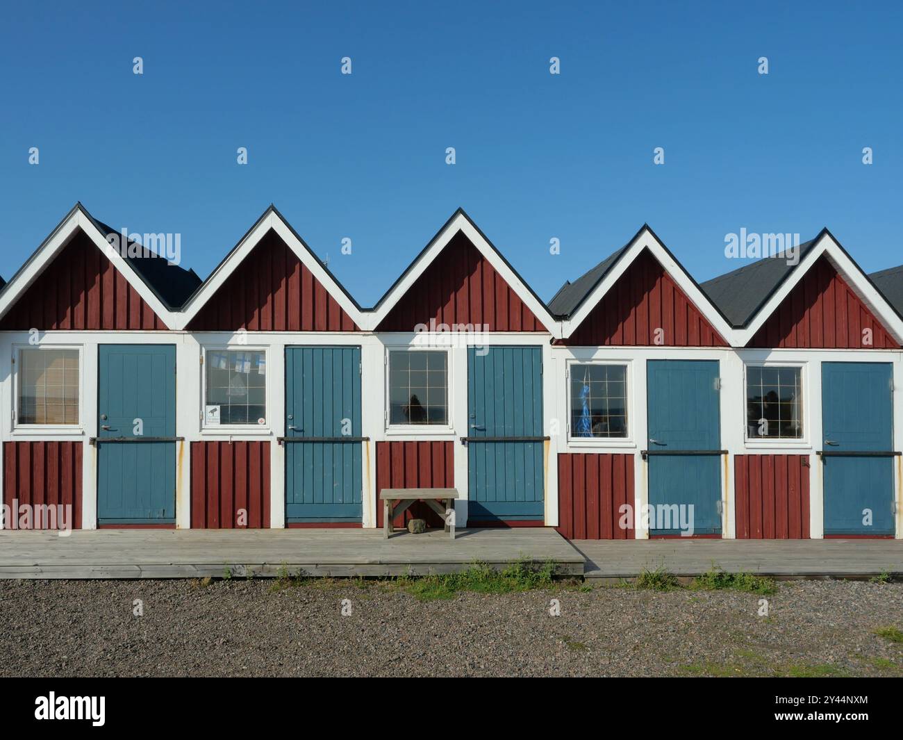 row of Swedish beach houses in typical wooden construction and Swedish ...