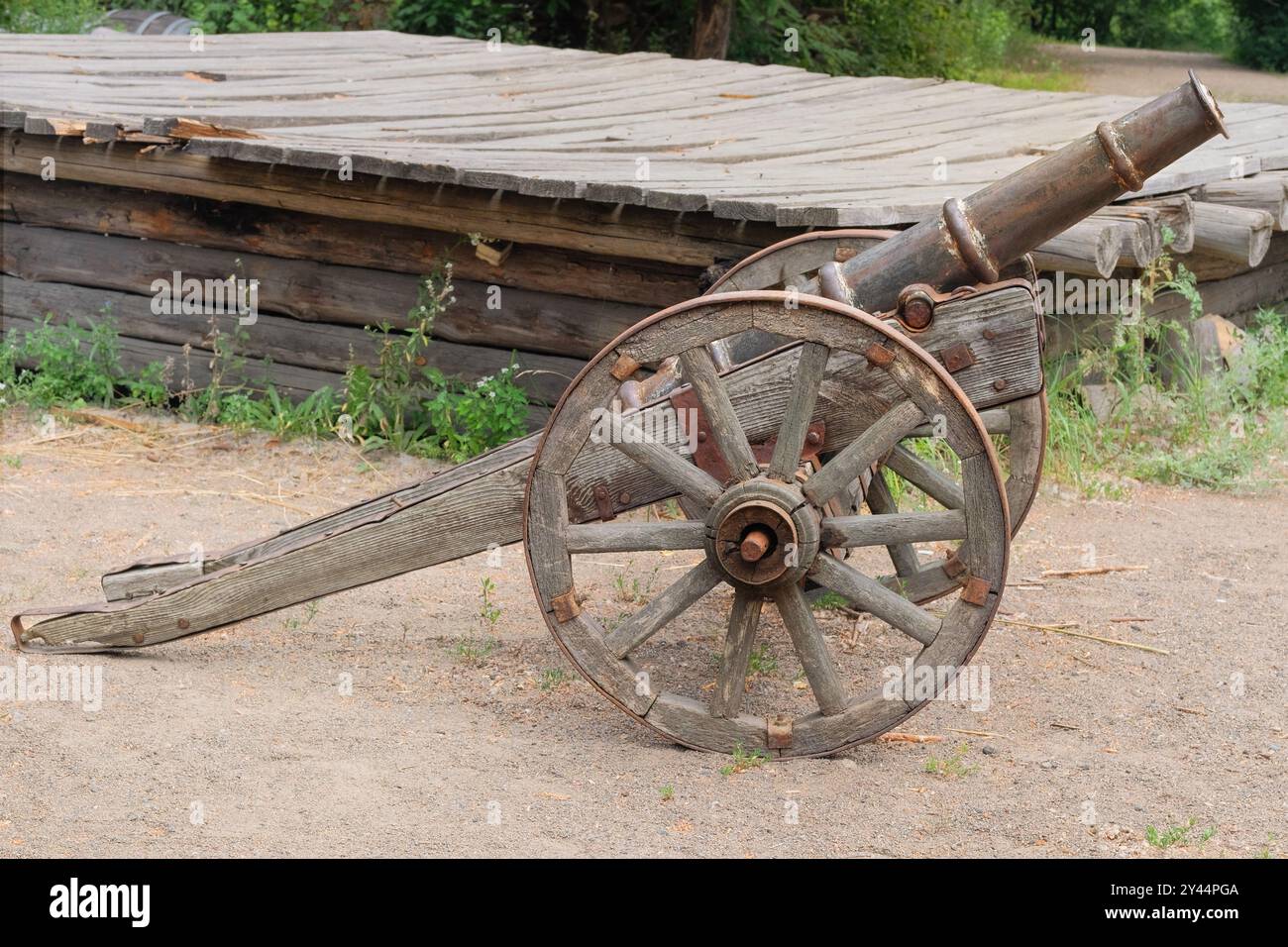 Old wooden cannon. Rusty metal cannons. Artillery Stock Photo - Alamy