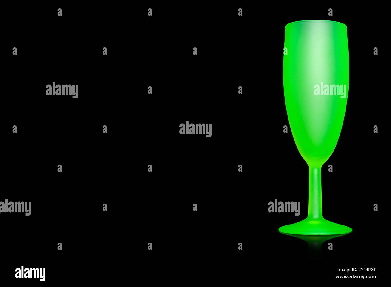 Green matt champaign glass isolated on black. Free space for text ...