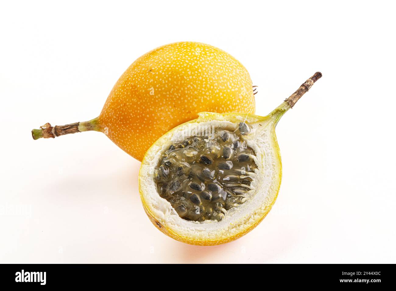 Yellow granadilla fruit with cut half Stock Photo - Alamy
