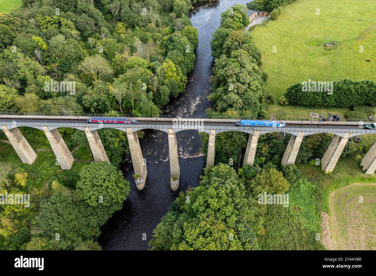 Narrow boats pass over the Pontcysyllte Aqueduct in North Wales, its 19 ...