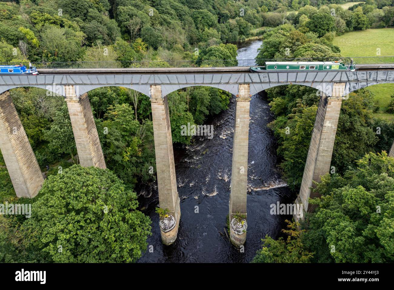 Narrow boats pass over the Pontcysyllte Aqueduct in North Wales, its 19 ...
