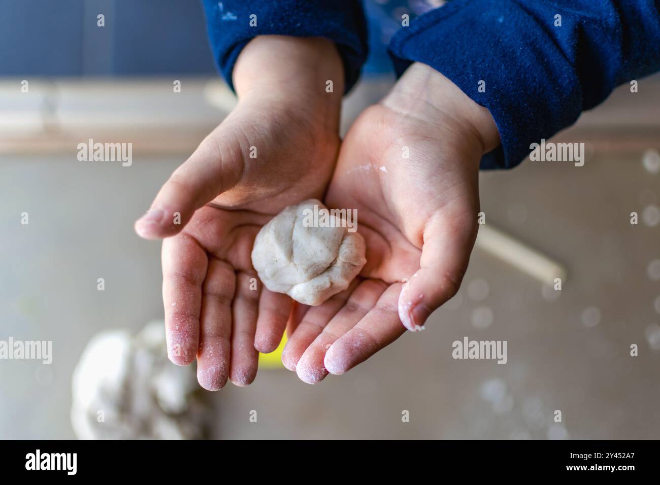 Child having fun modeling salt dough, authentic activity, fine motor ...