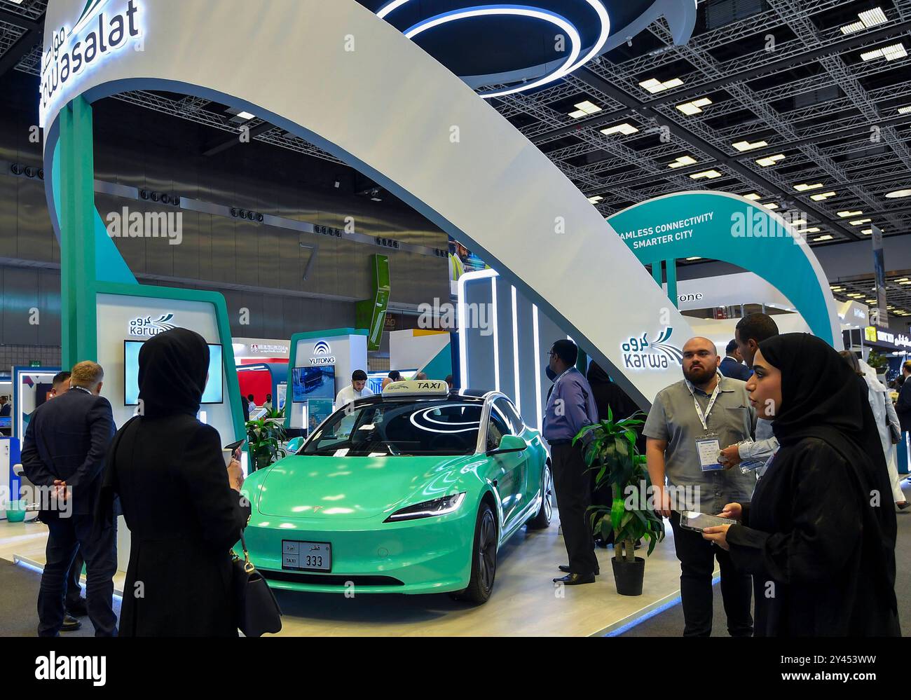 THE CONTEQ EXPO24 OPENING IN DOHA A visiter takes a picture of Tesla ...