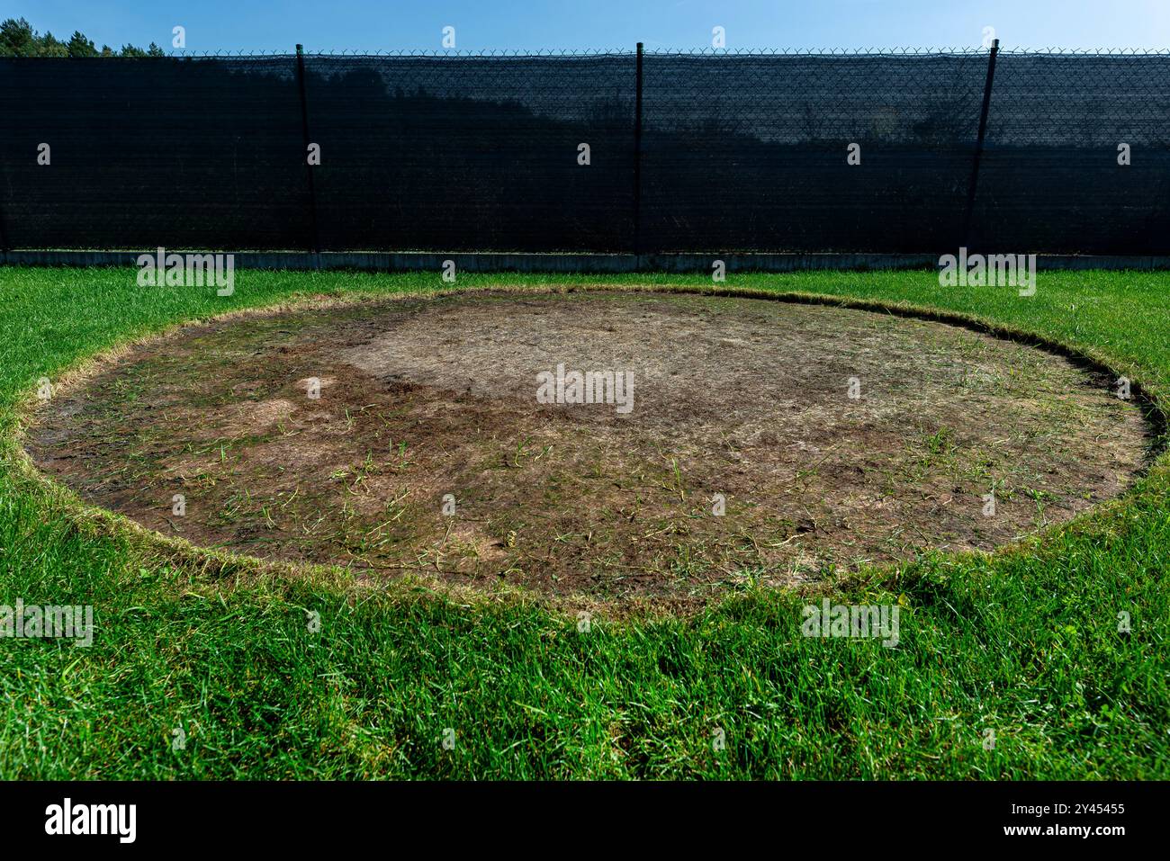 A burn mark on the lawn from the round outdoor swimming pool in the ...