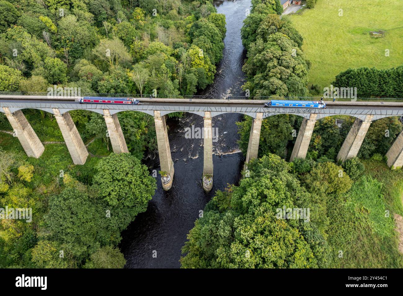 Narrow boats pass over the Pontcysyllte Aqueduct in North Wales, its 19 ...