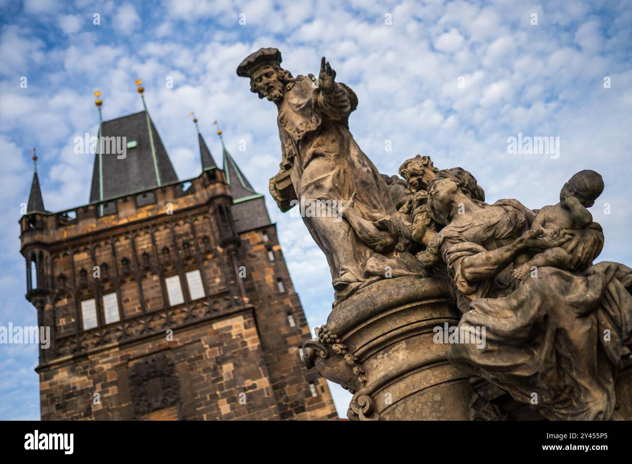 Statue of Saint Ivo Of Kermartin and old tower at Charles Bridge in ...