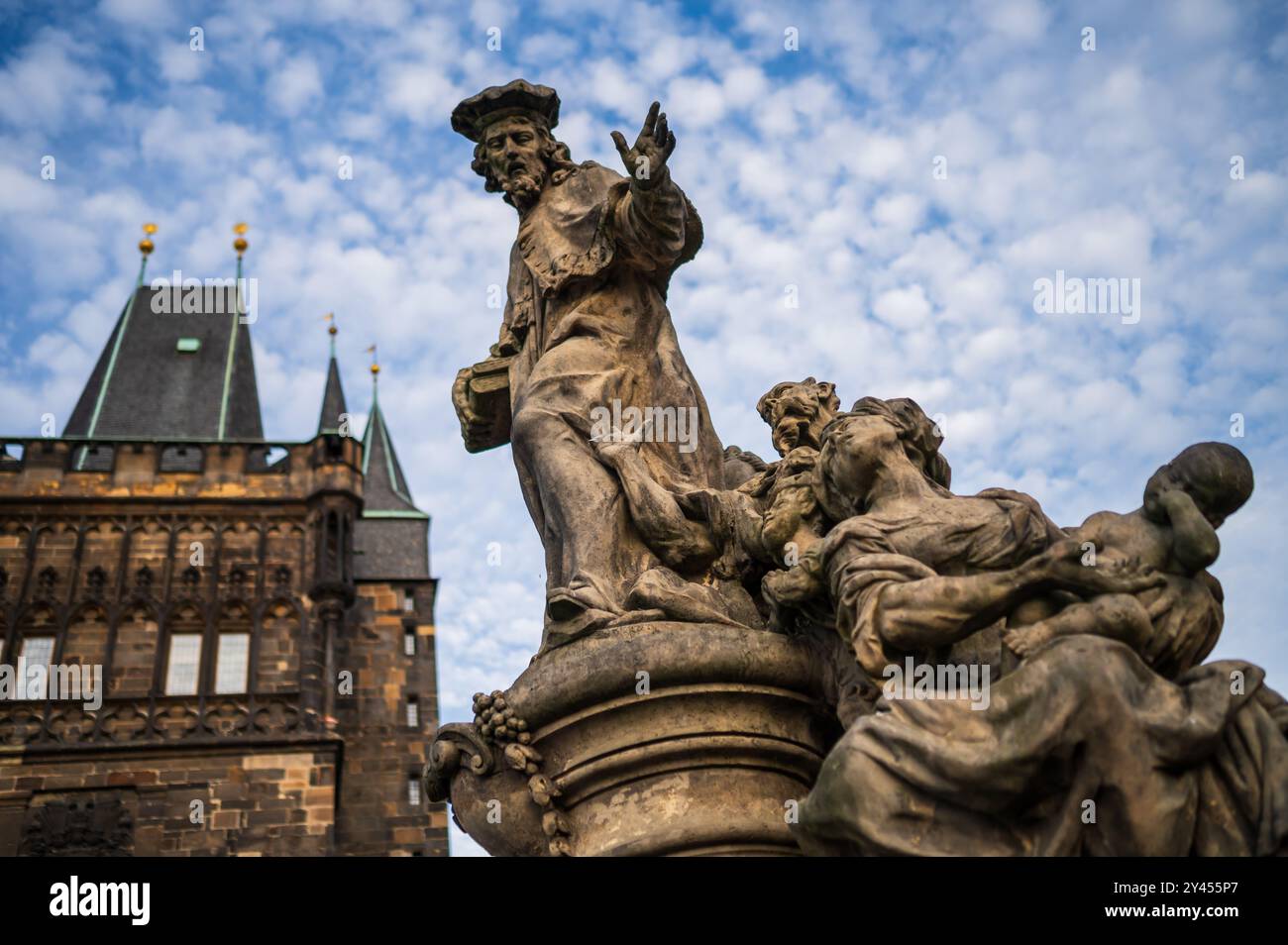 Statue of Saint Ivo Of Kermartin and old tower at Charles Bridge in ...