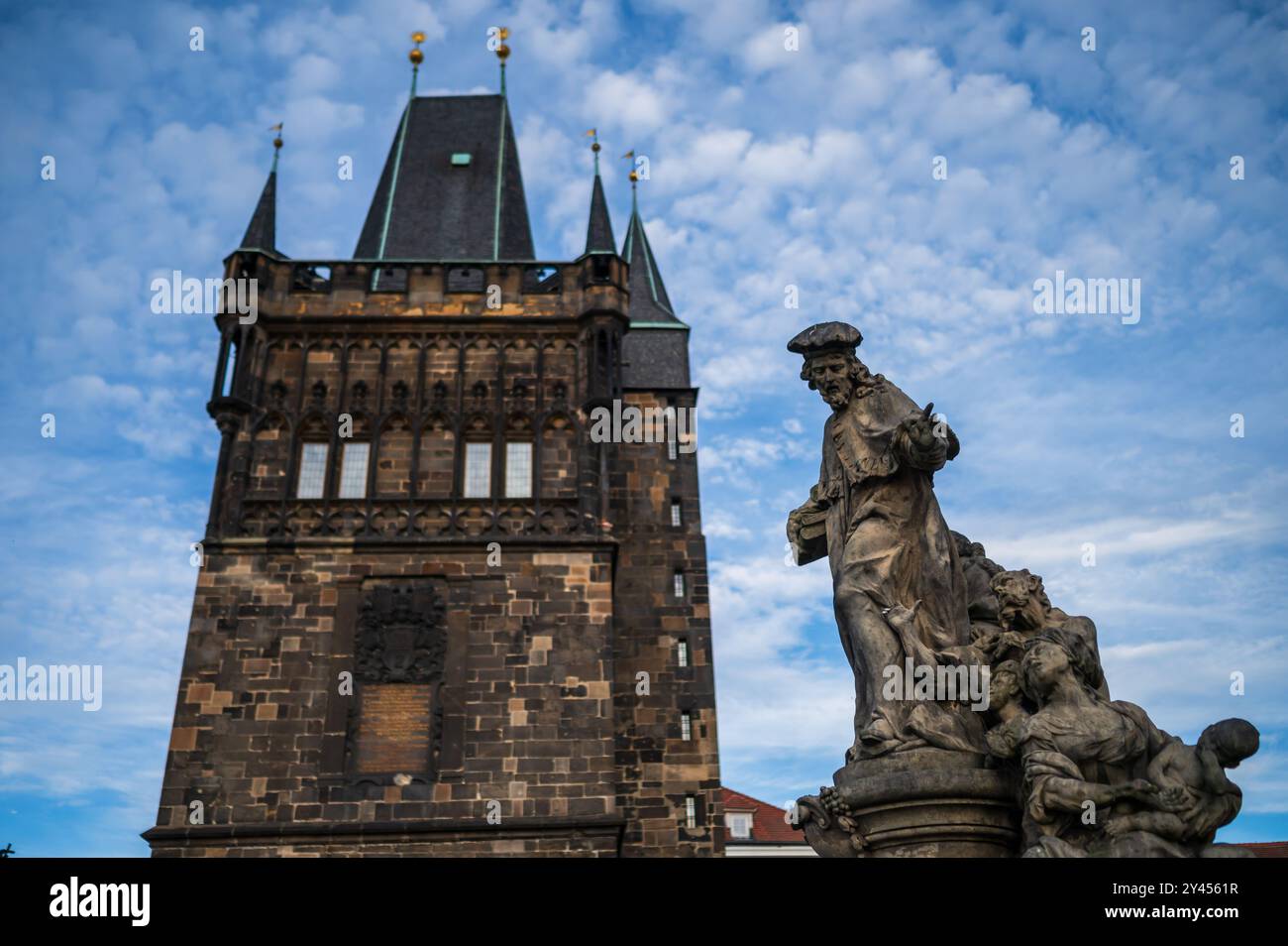 Statue of Saint Ivo Of Kermartin and old tower at Charles Bridge in ...