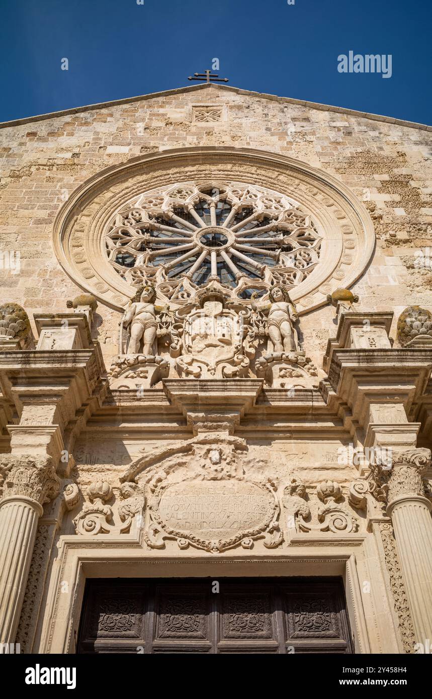 Looking up at the rose window on the front of the Romanesque Otranto ...