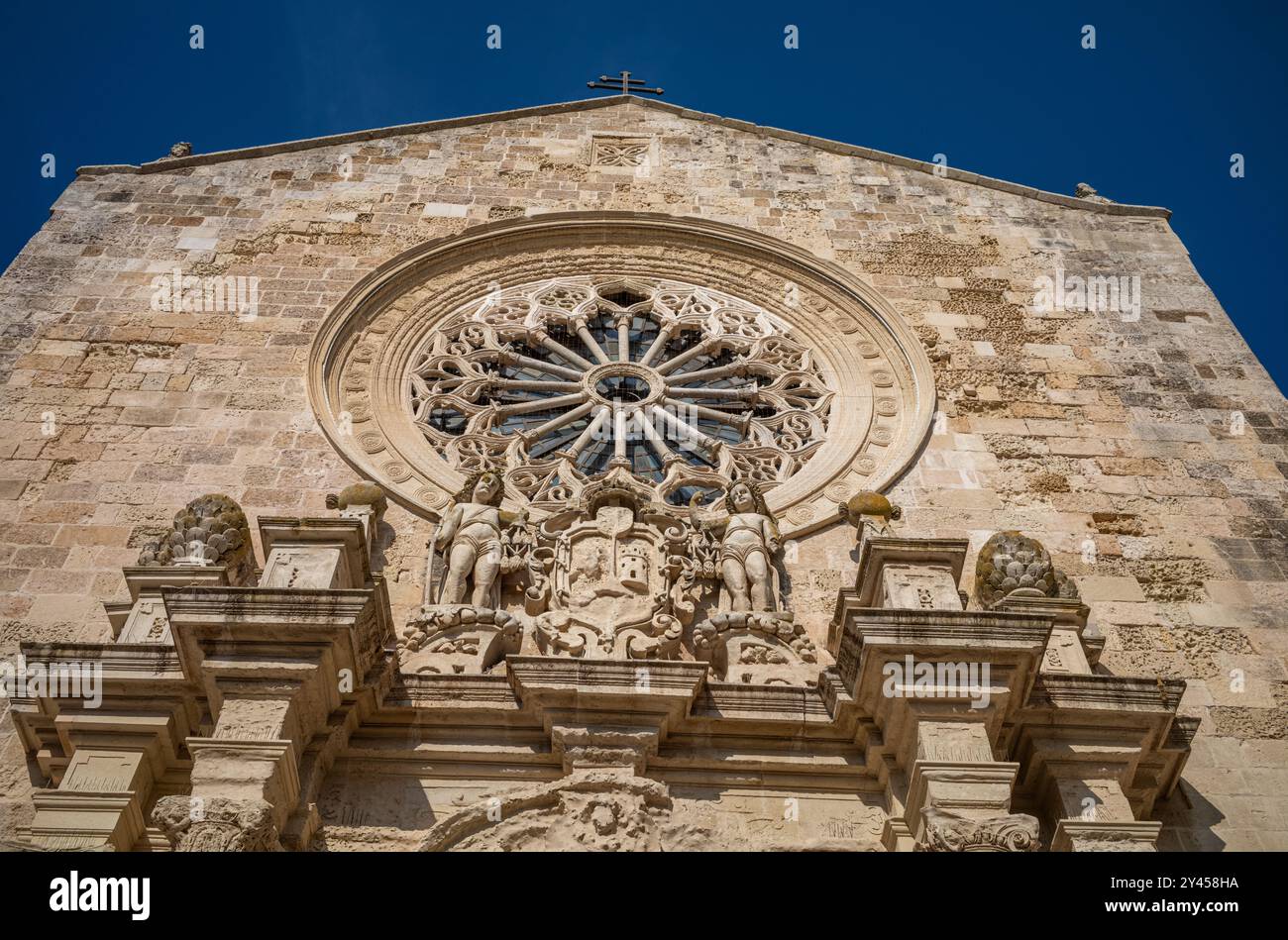 Looking up at the rose window on the front of the Romanesque Otranto ...