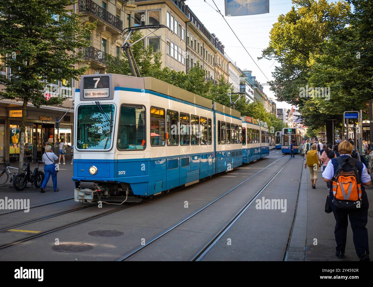 The number 7 tram pulls away from a tram stop in Bahnhofstrasse in ...