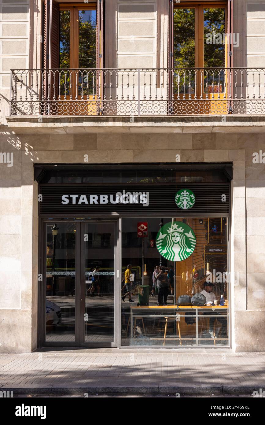 Barcelona, Spain - September 15, 2024: Patrons relaxing with coffee ...