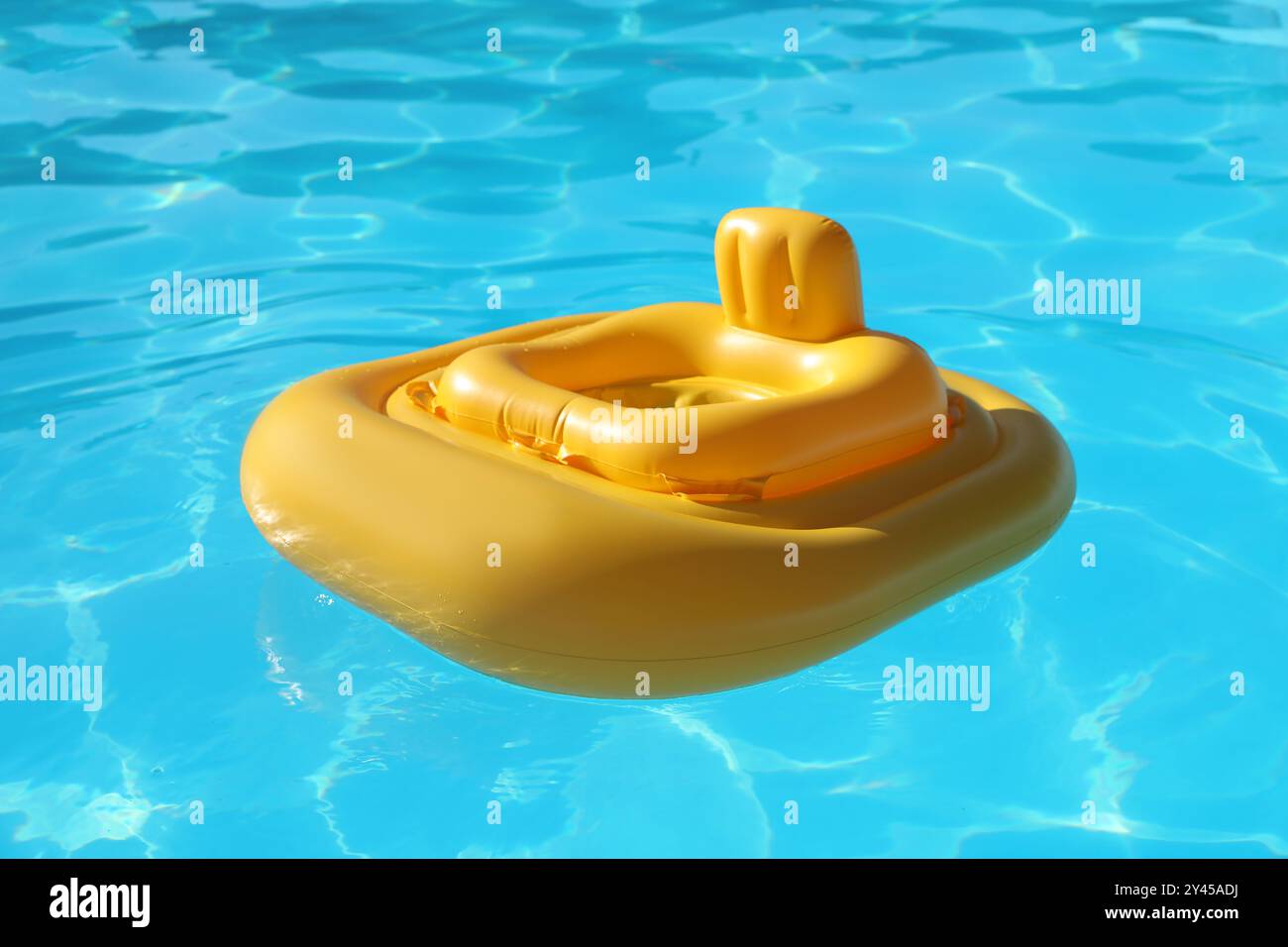 Yellow float in swimming pool at luxury resort Stock Photo - Alamy