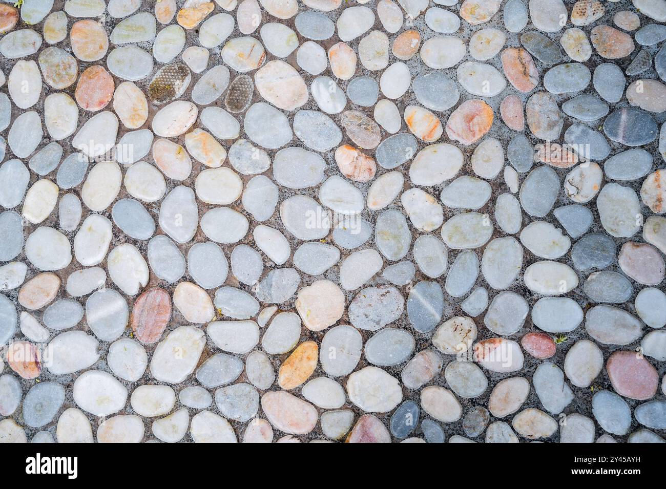 Wall round stone rock texture. background Stock Photo - Alamy