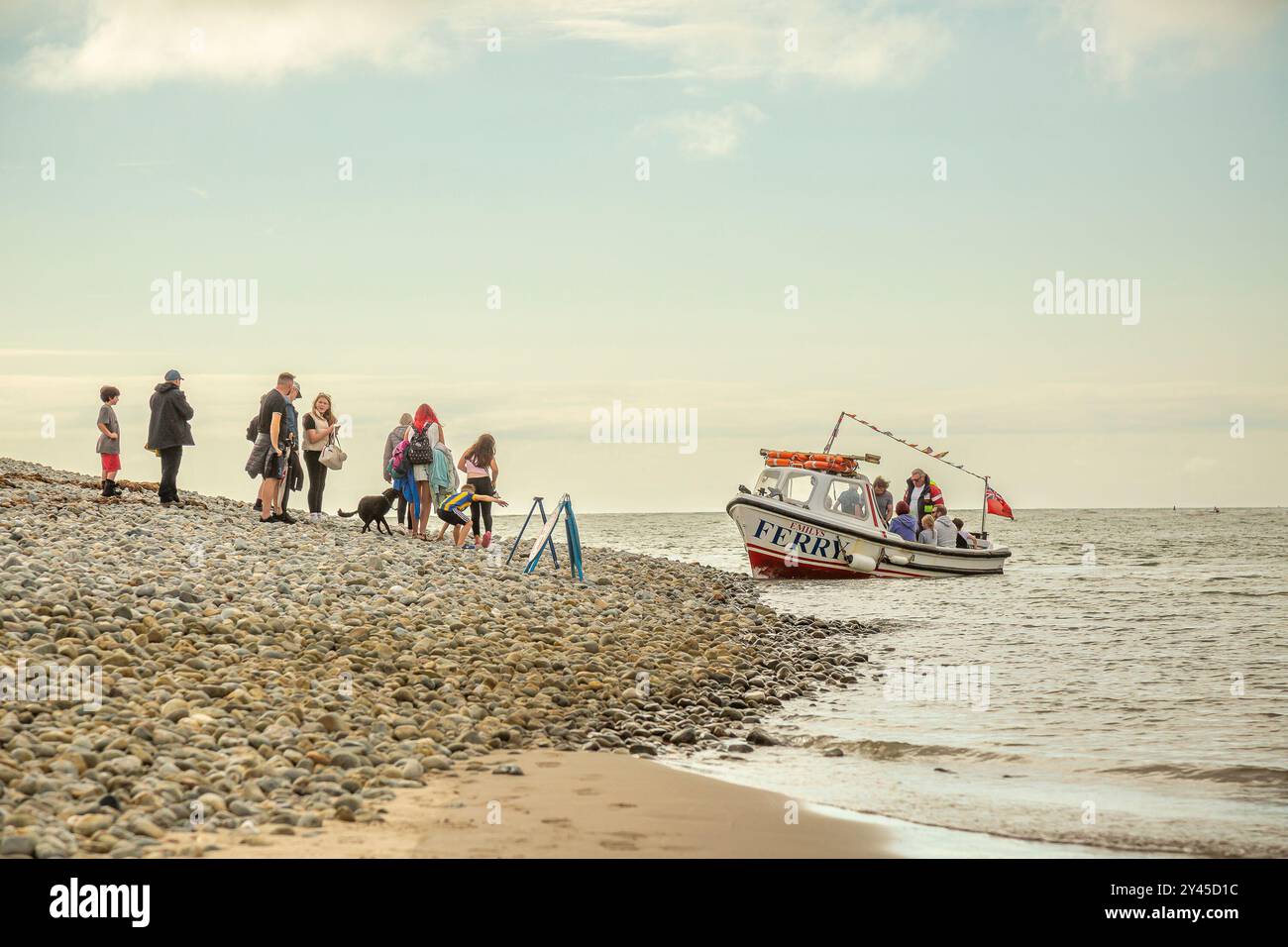 People waiting for the Barmouth Ferry at Penrhyn Point, Fairbourne: a ...