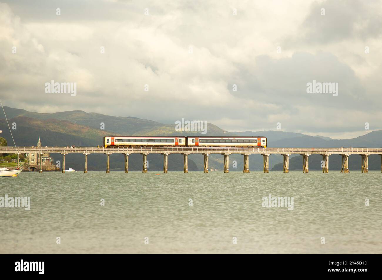 Train crossing over Barmouth Bridge in Welsh county of Gwynedd, the ...