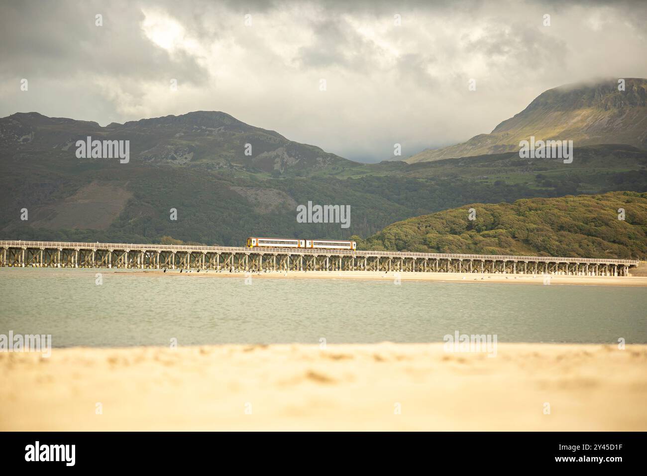 Train crossing over Barmouth Bridge in Welsh county of Gwynedd, the ...