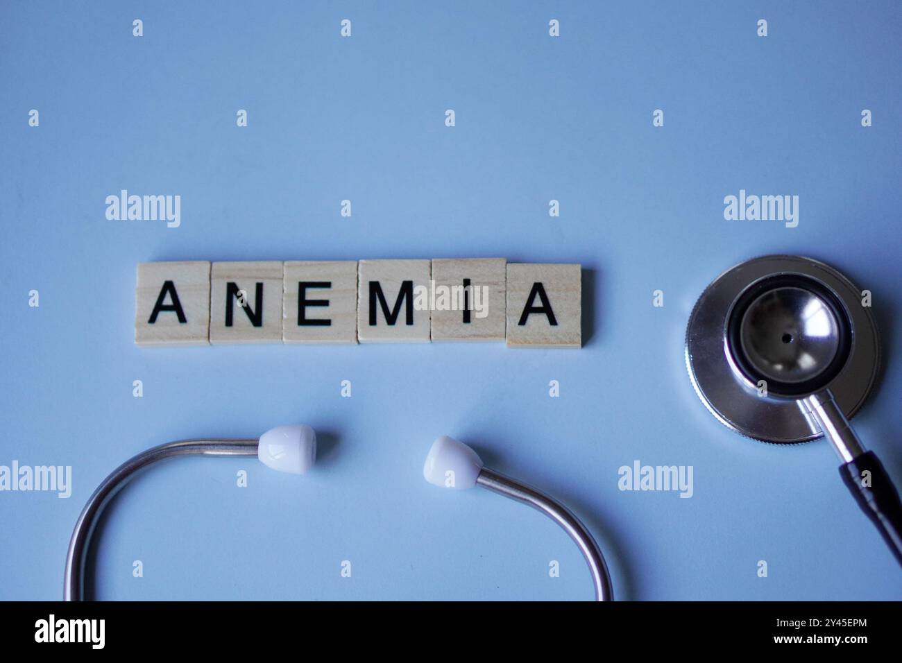 ANEMIA, wooden blocks with letters and stethoscope with light blue ...