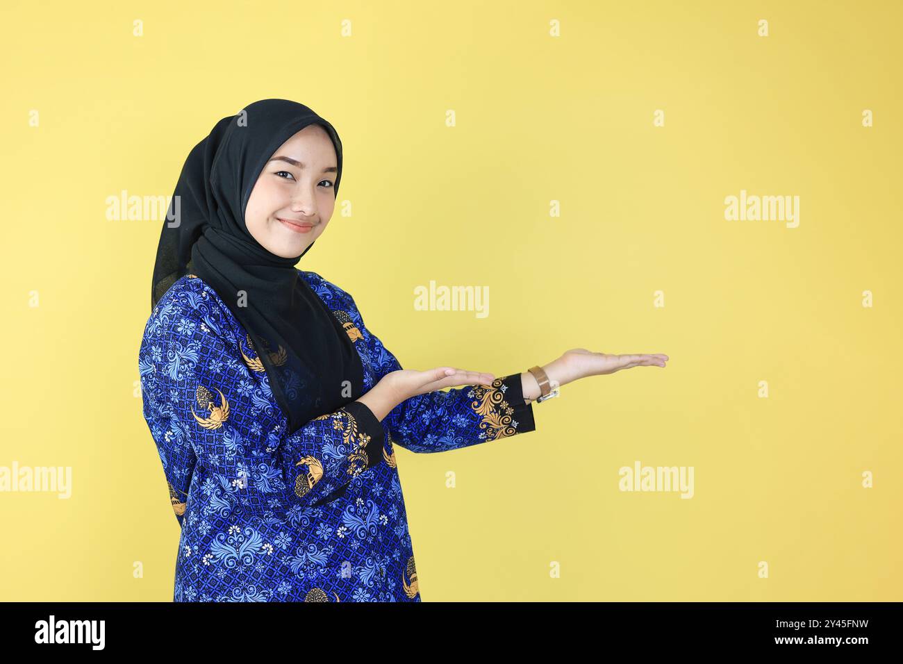 Female Indonesian ASN Wearing Hijab and Korpri Uniform Pointing on the ...