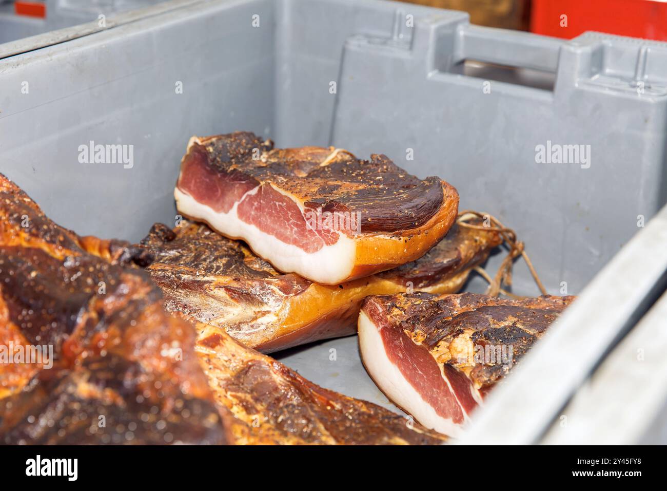 Delicious smoked ham, cured meat slabs, gourmet meat product, stored in ...