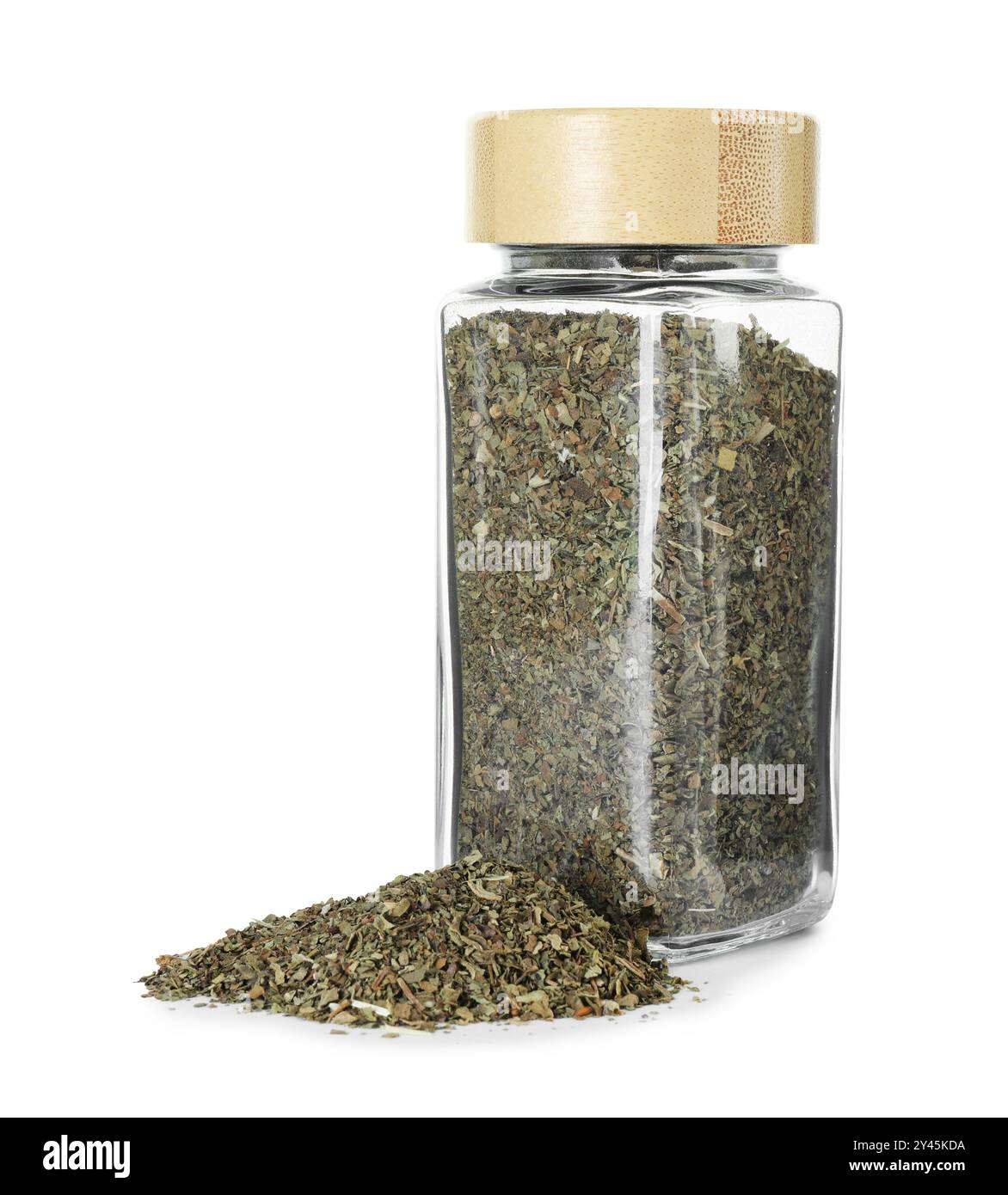 Dry basil in glass jar isolated on white Stock Photo - Alamy