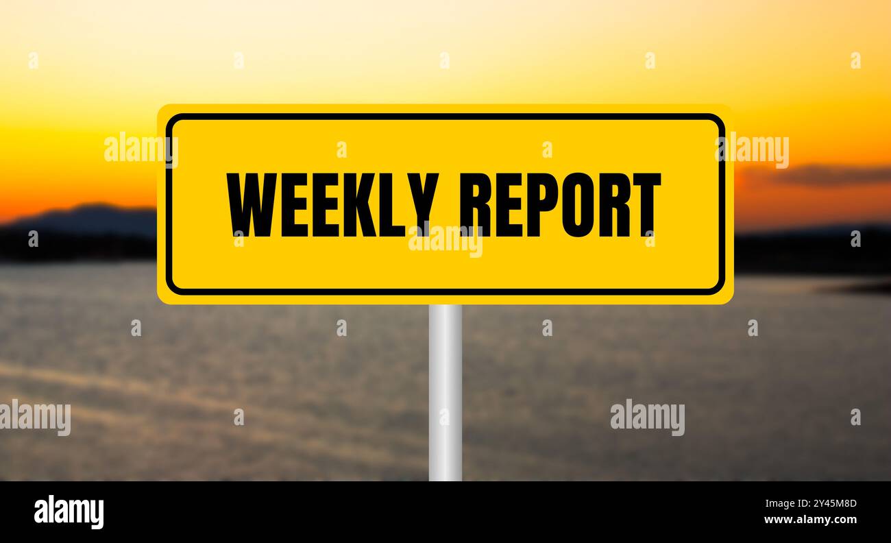 Weekly report message written on yellow sign with blurry lake ...