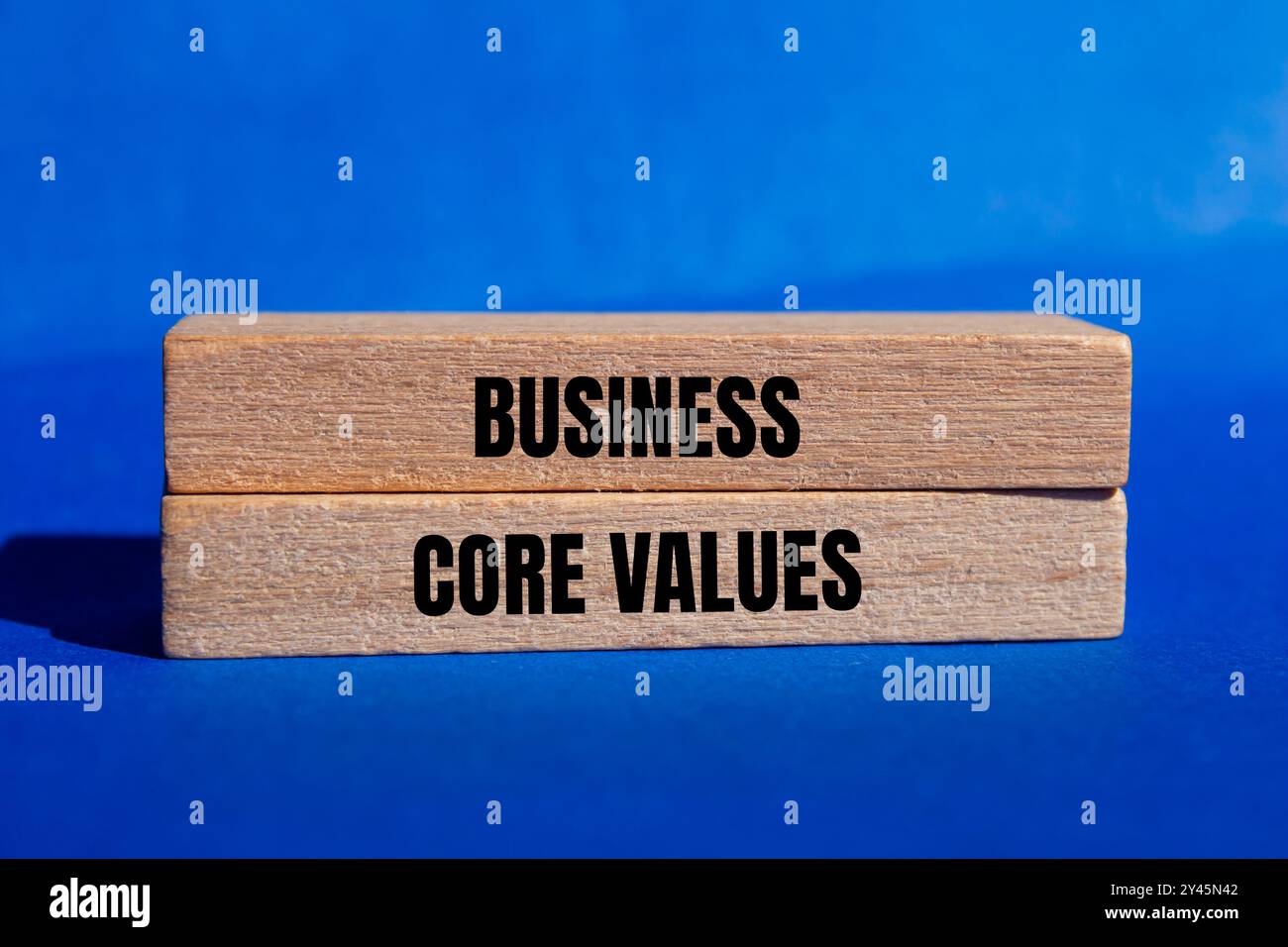Business core values message written on wooden blocks with blue ...