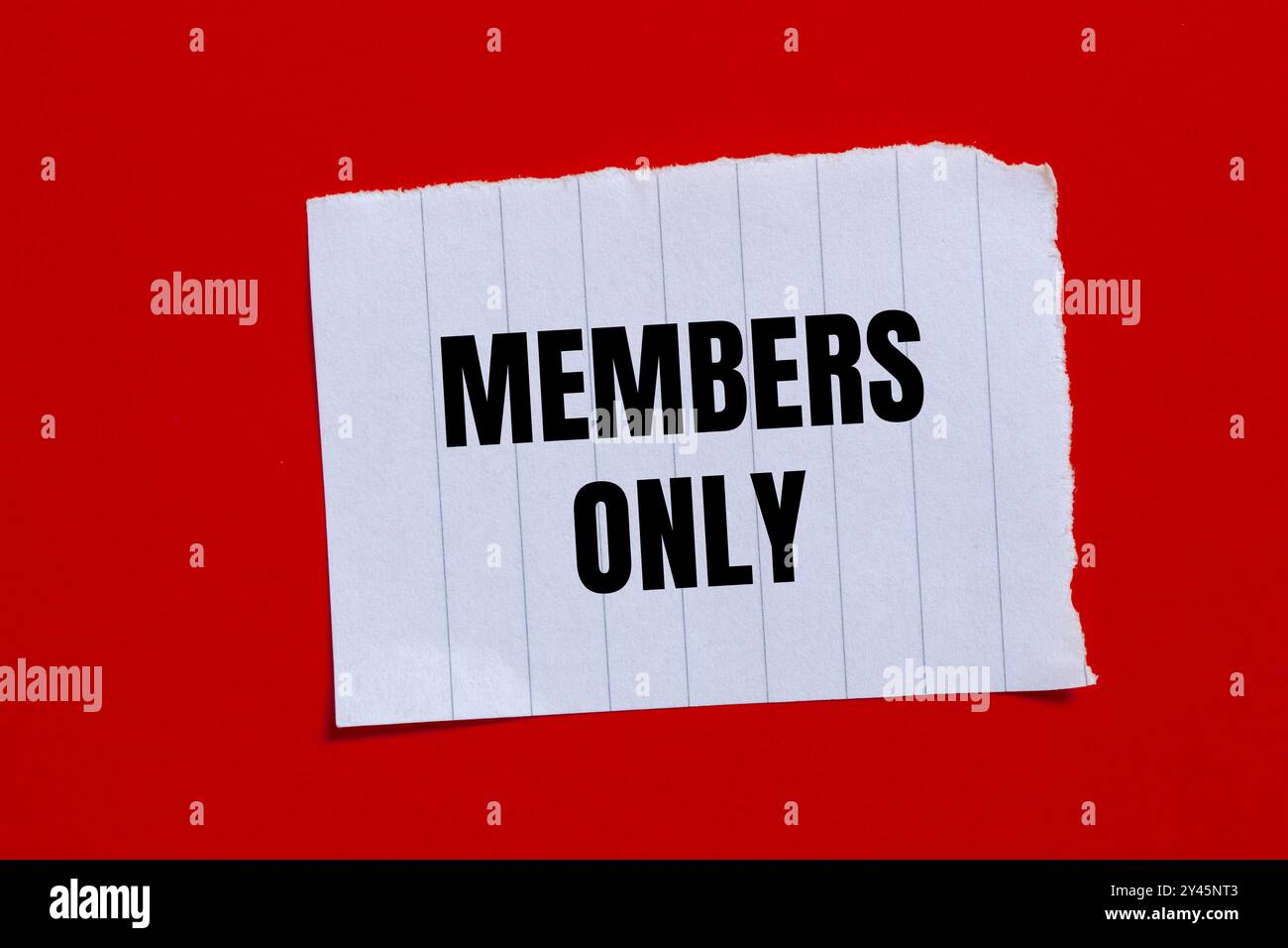 Members only message written on ripped torn paper piece with red ...