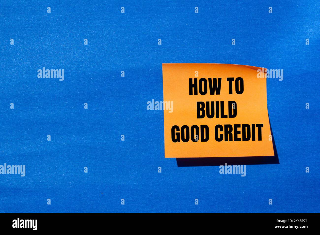 How to build good credit message written on orange paper with blue ...