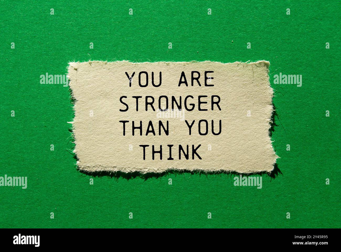 You are stronger than you think message written on ripped torn paper ...