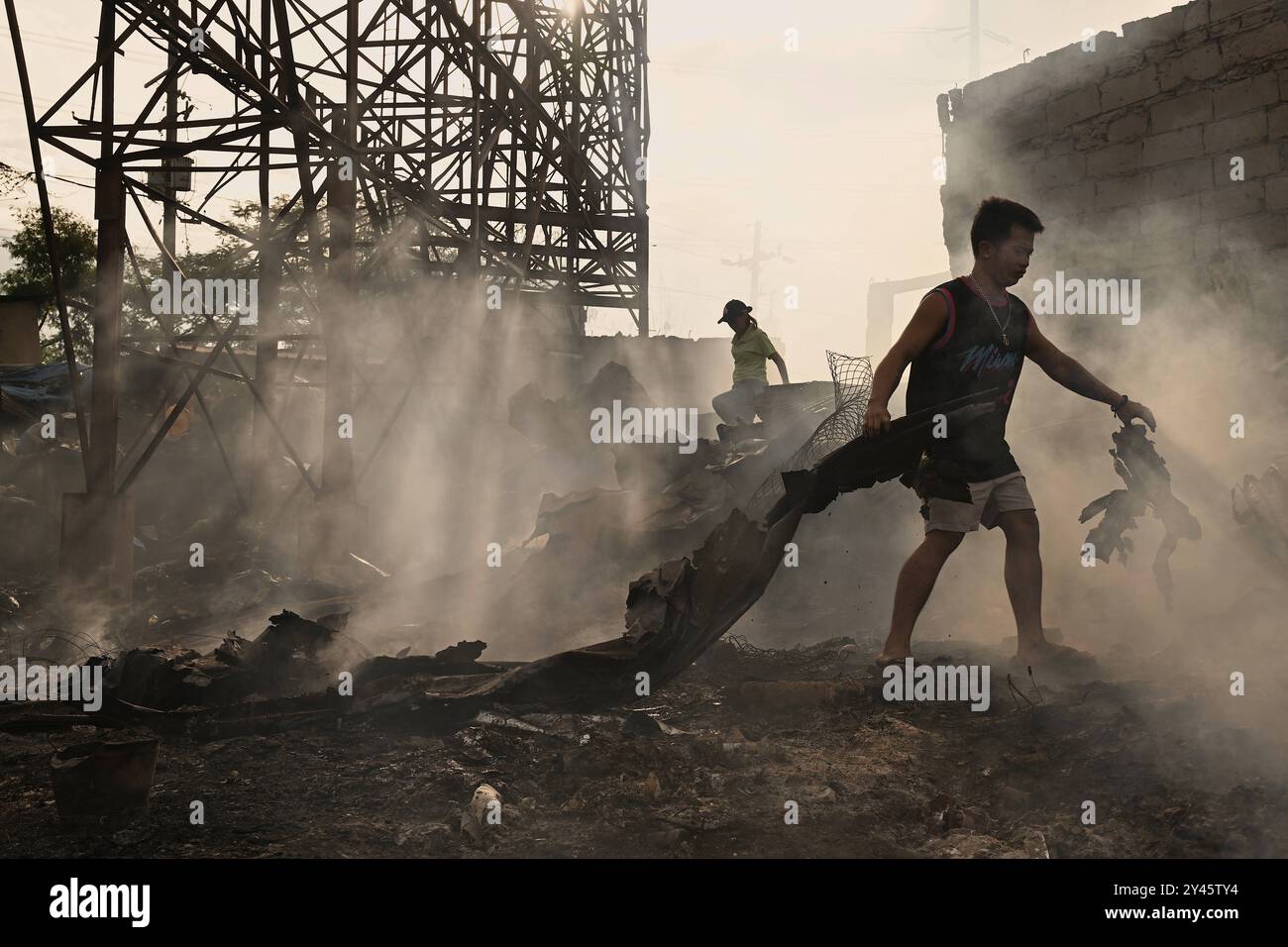 Aftermath of a fire in the Bacoor, Cavite, south of Manila People ...