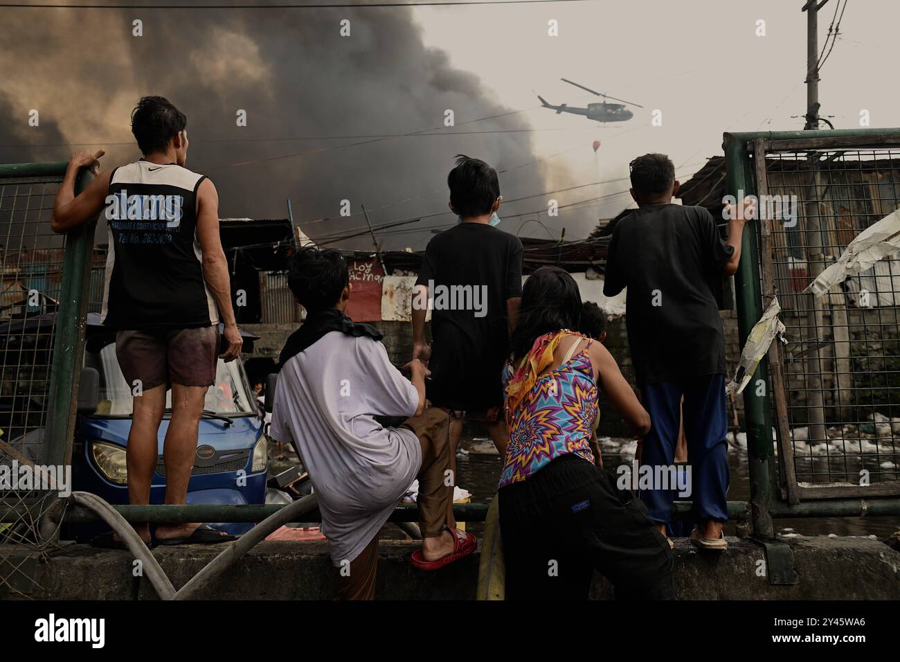 Fire in informal settlement in Manila, Philippines Residents look on ...