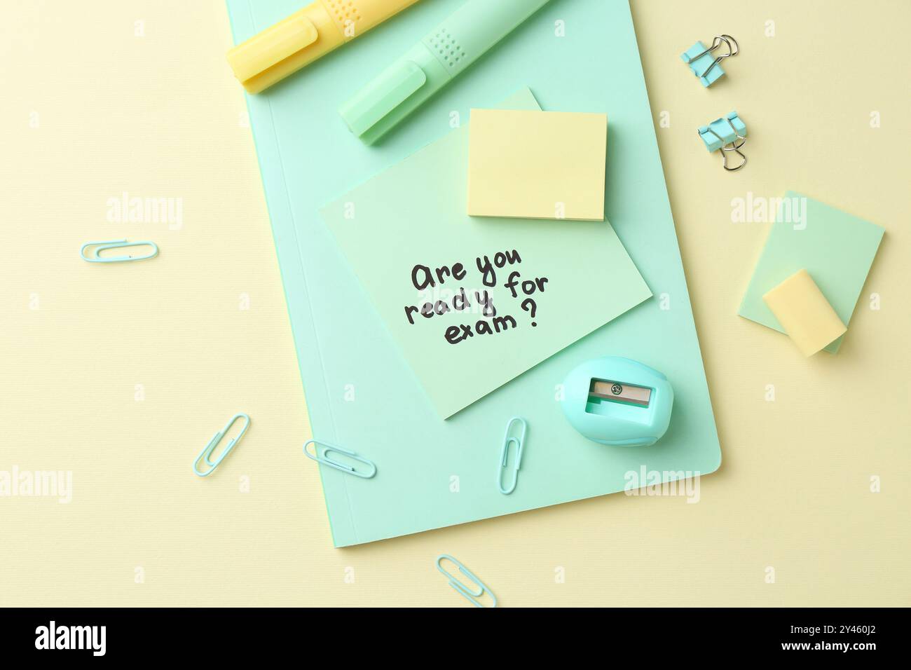 Paper note with question Are You Ready For Exam and stationery on pale ...