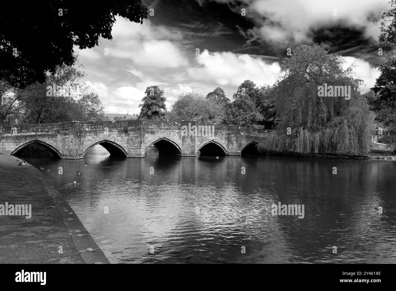 The stone road bridge over the river Wye, Bakewell Town, Peak District ...