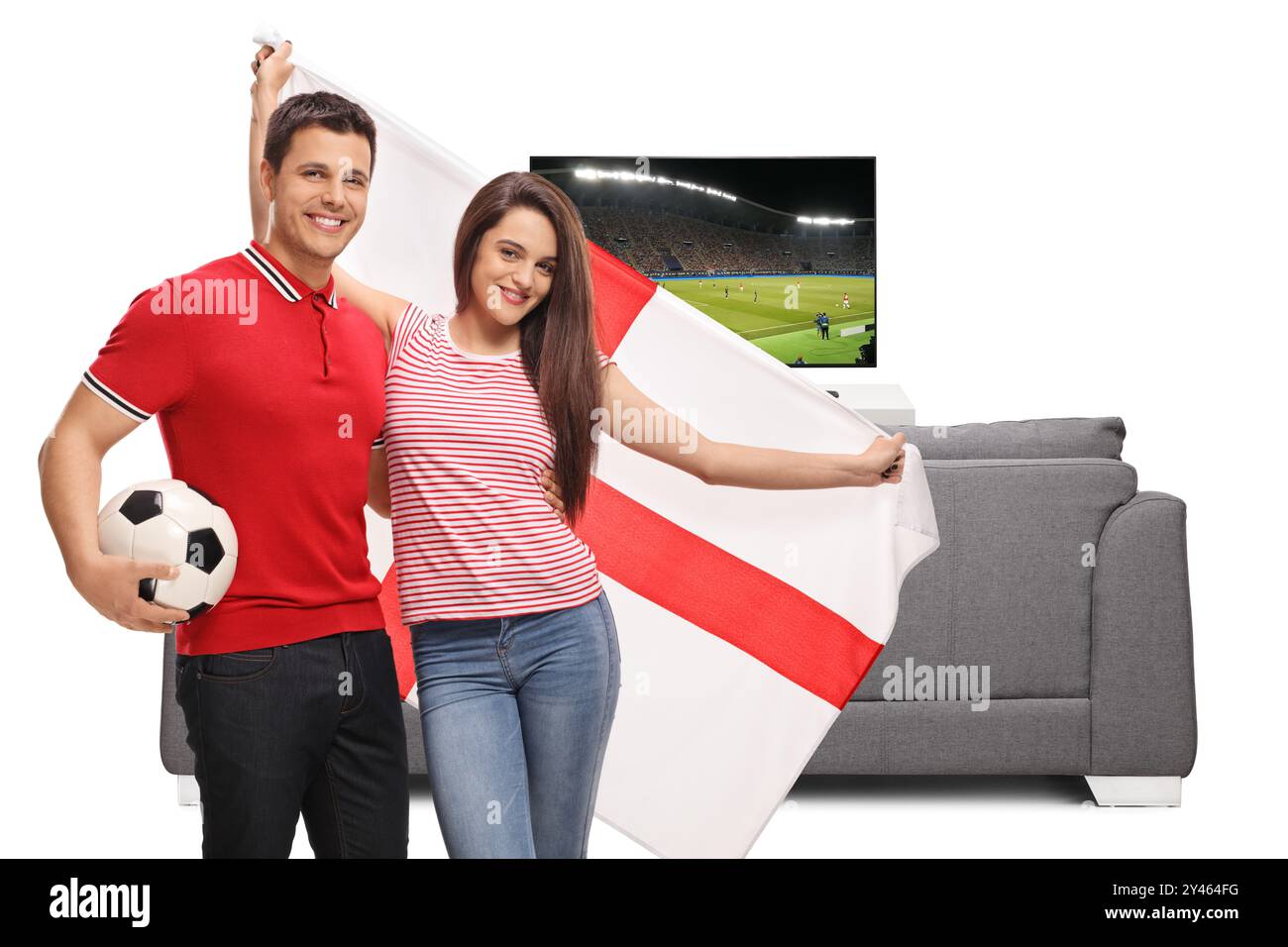 Young couple football fans with an English flag cheering in front of tv ...
