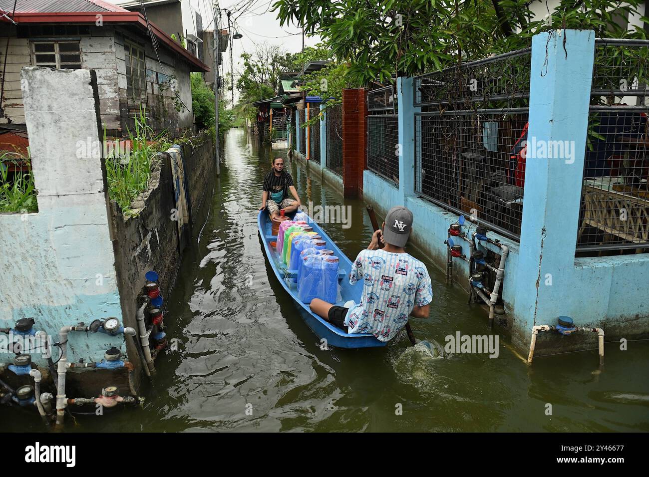 Flooding caused by typhoon Yagi in Philippines People ride on boat to ...