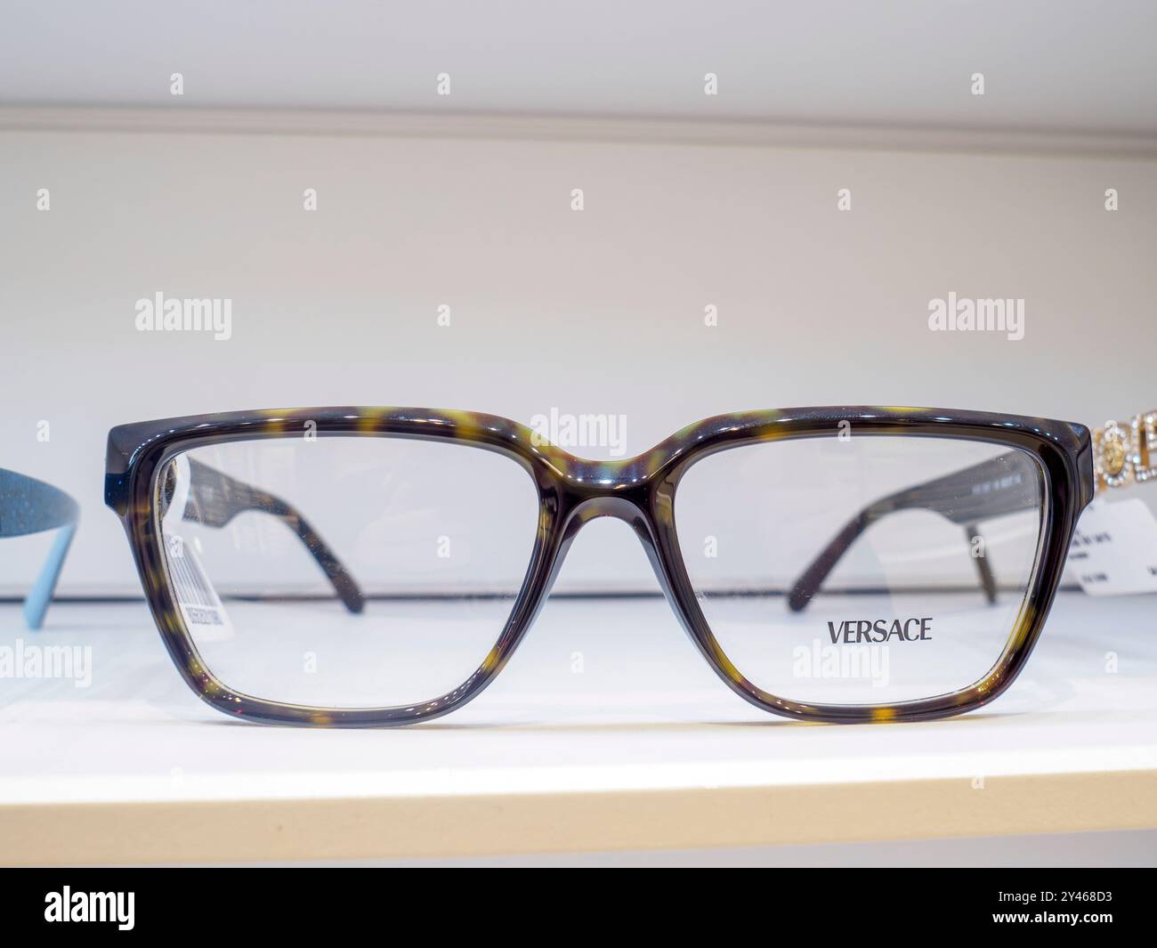 Fashionable eyeglasses with tortoise shell frames are sitting on a ...