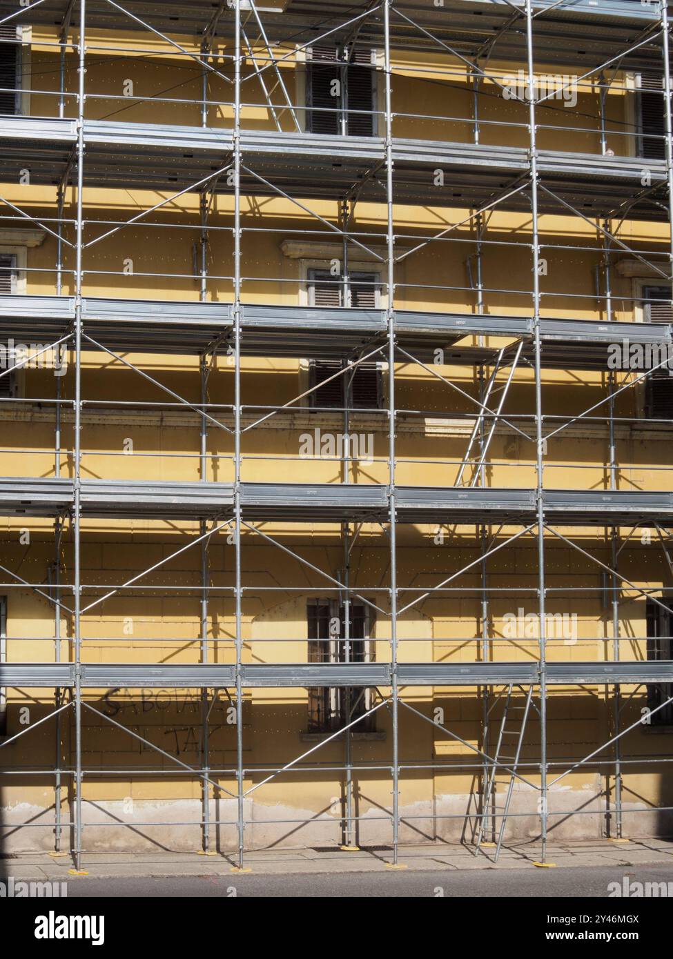 Cremona, Italy August 31st 2024 Metal scaffolding covering the facade ...