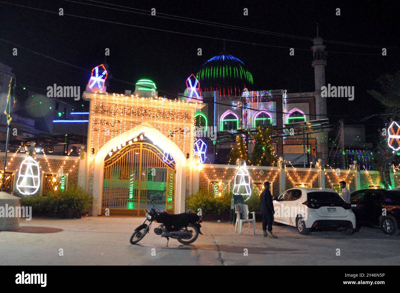 A beautiful illuminated view of mosque building decorated with lights ...