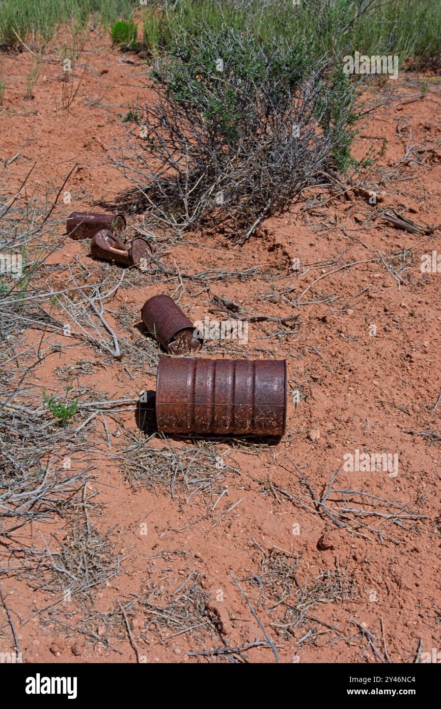 Rusty cans litter red sandy valley ground of Valley of the gods Stock ...